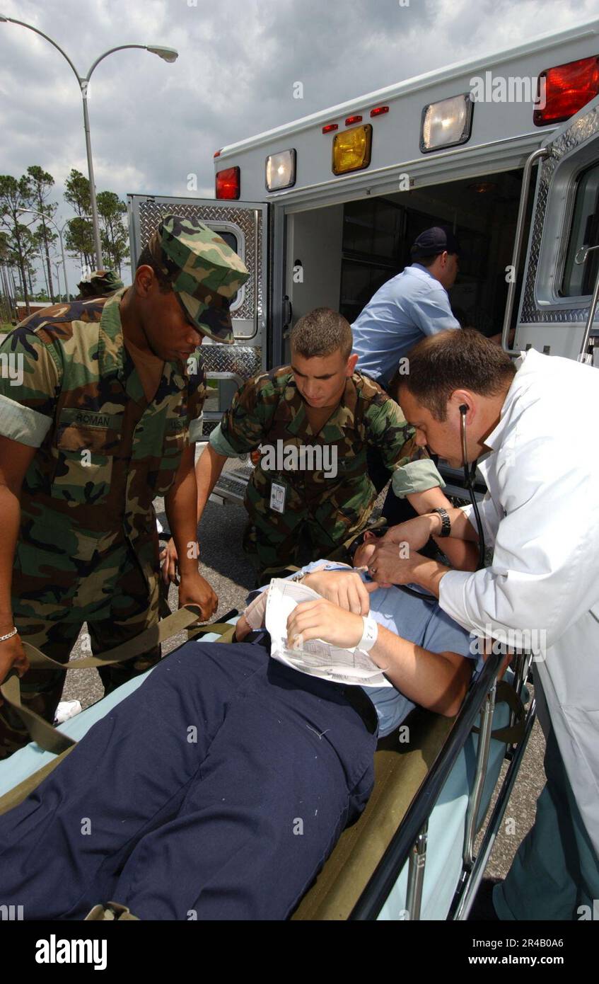 US Navy U.S. Navy medical personnel provide medical assistance to a ...