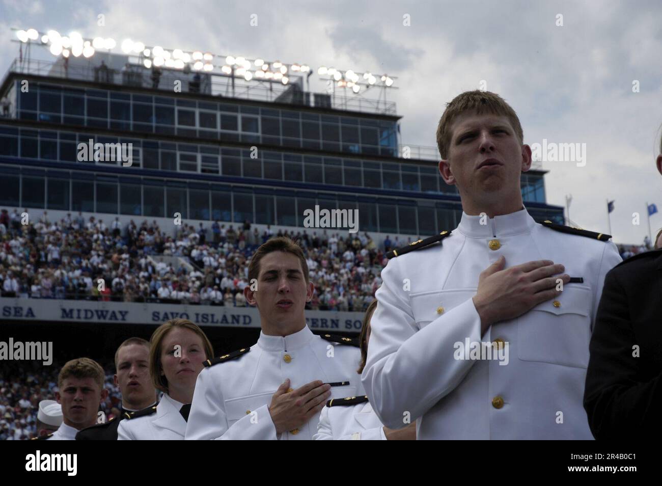 US Navy Newly commissioned Ensigns and Second Lieutenants sing the U.S ...