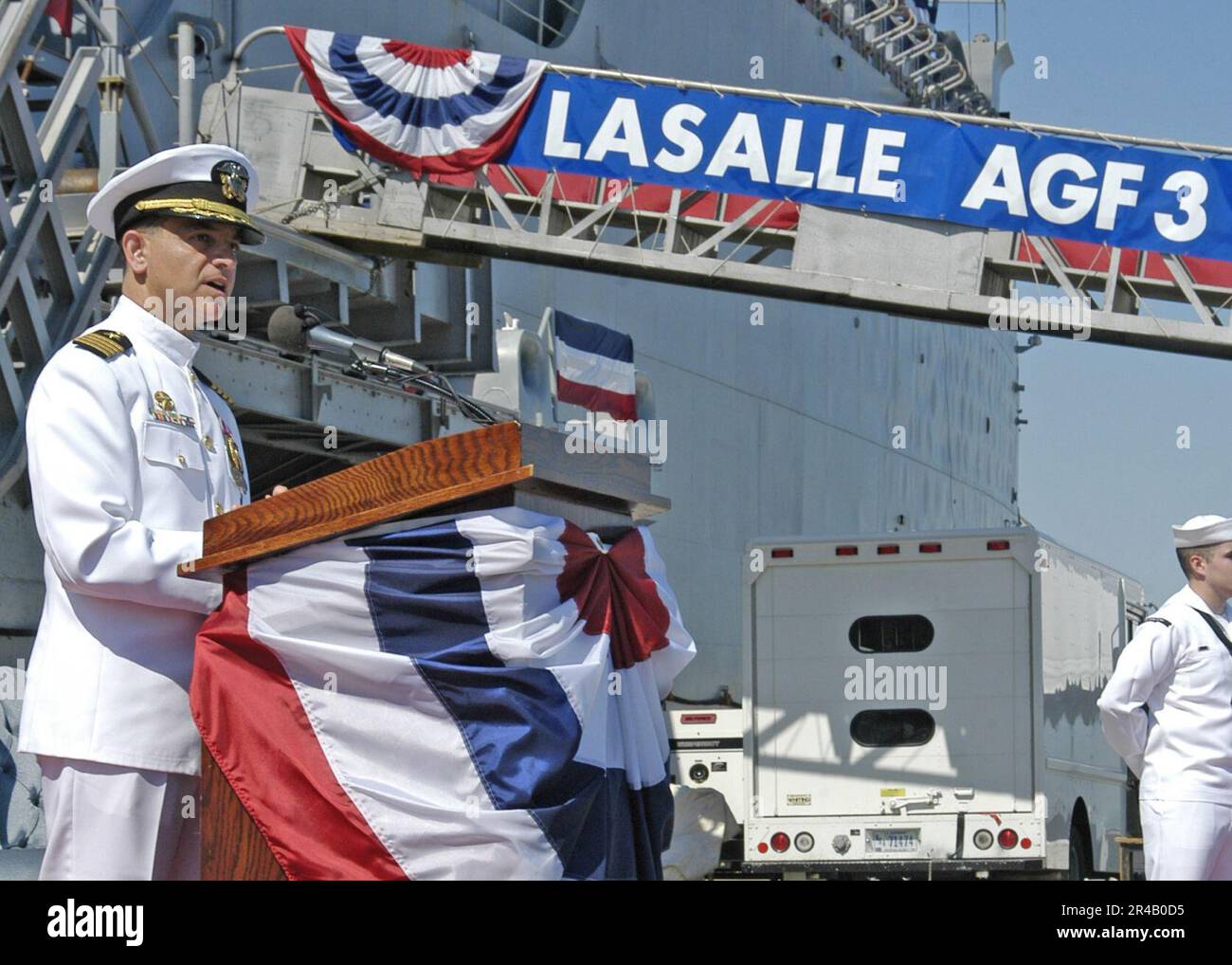 US Navy Commanding Officer, USS La Salle (AGF 3), Capt. speaks to the crowd of distinguished ...