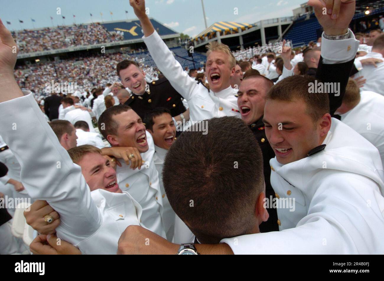 US Navy Newly commissioned officers celebrate their new positions with ...