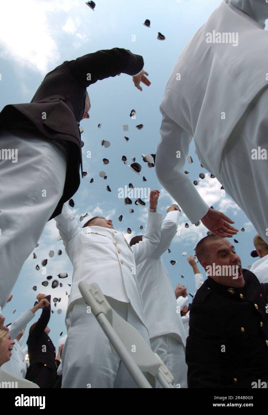 US Navy Newly commissioned officers celebrate their new positions by ...