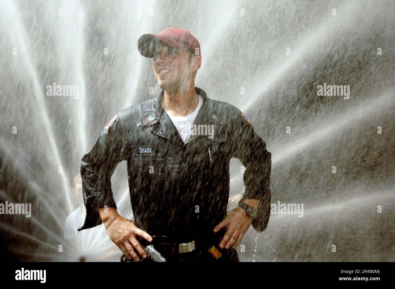 US Navy Hull Technician 2nd Class receives a cool, high velocity spray ...