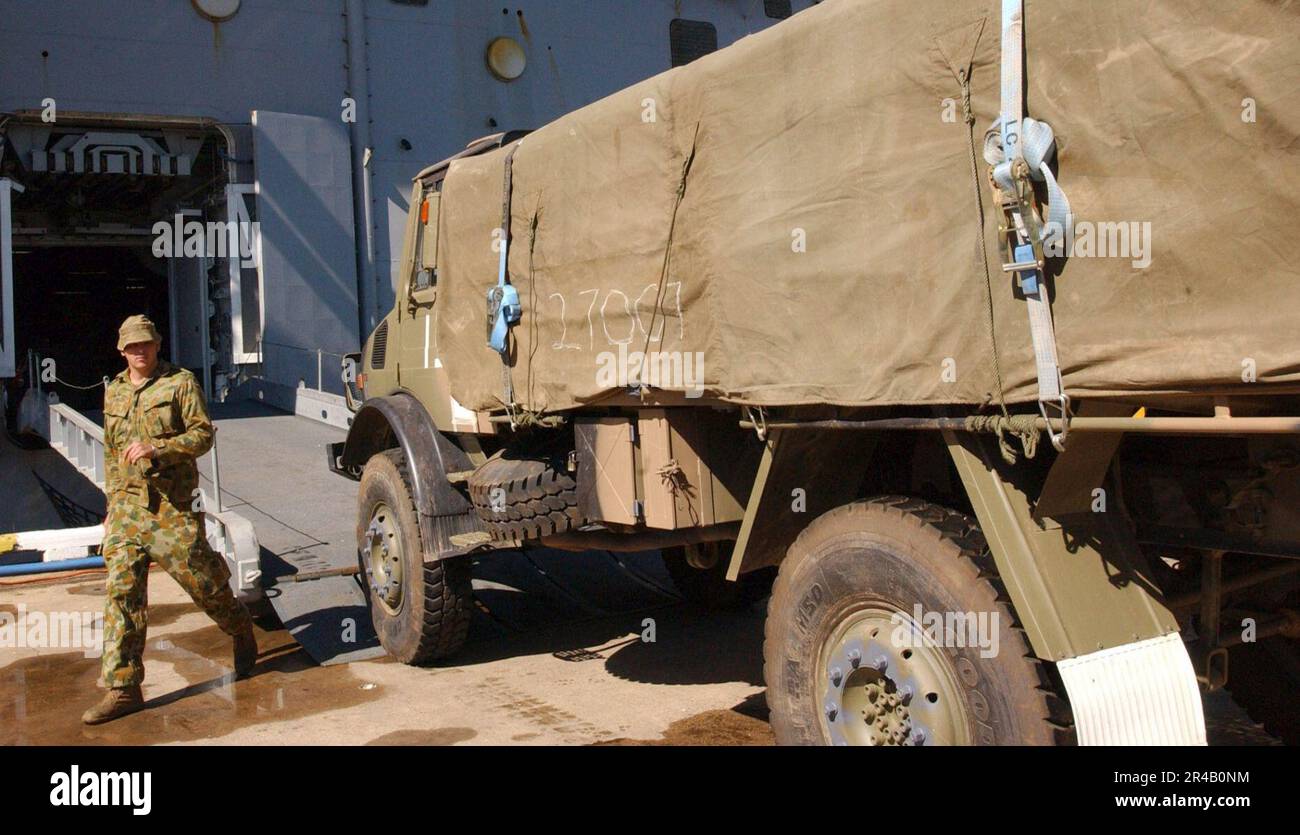 US Navy An Royal Australian Army cargo truck is prepared for loading ...