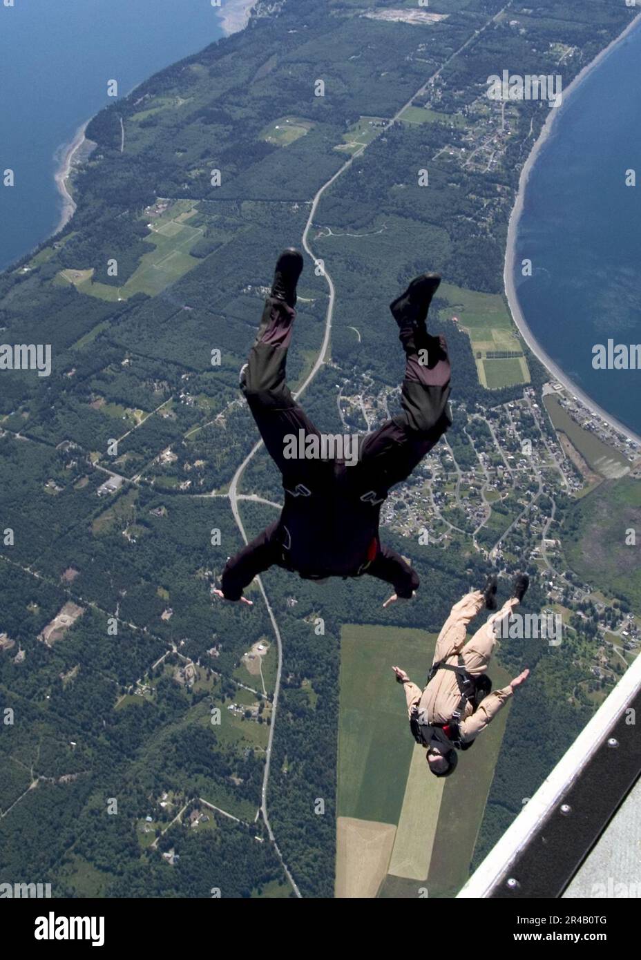 US Navy Master Chief Hull Maintenance Technician foreground, and ...