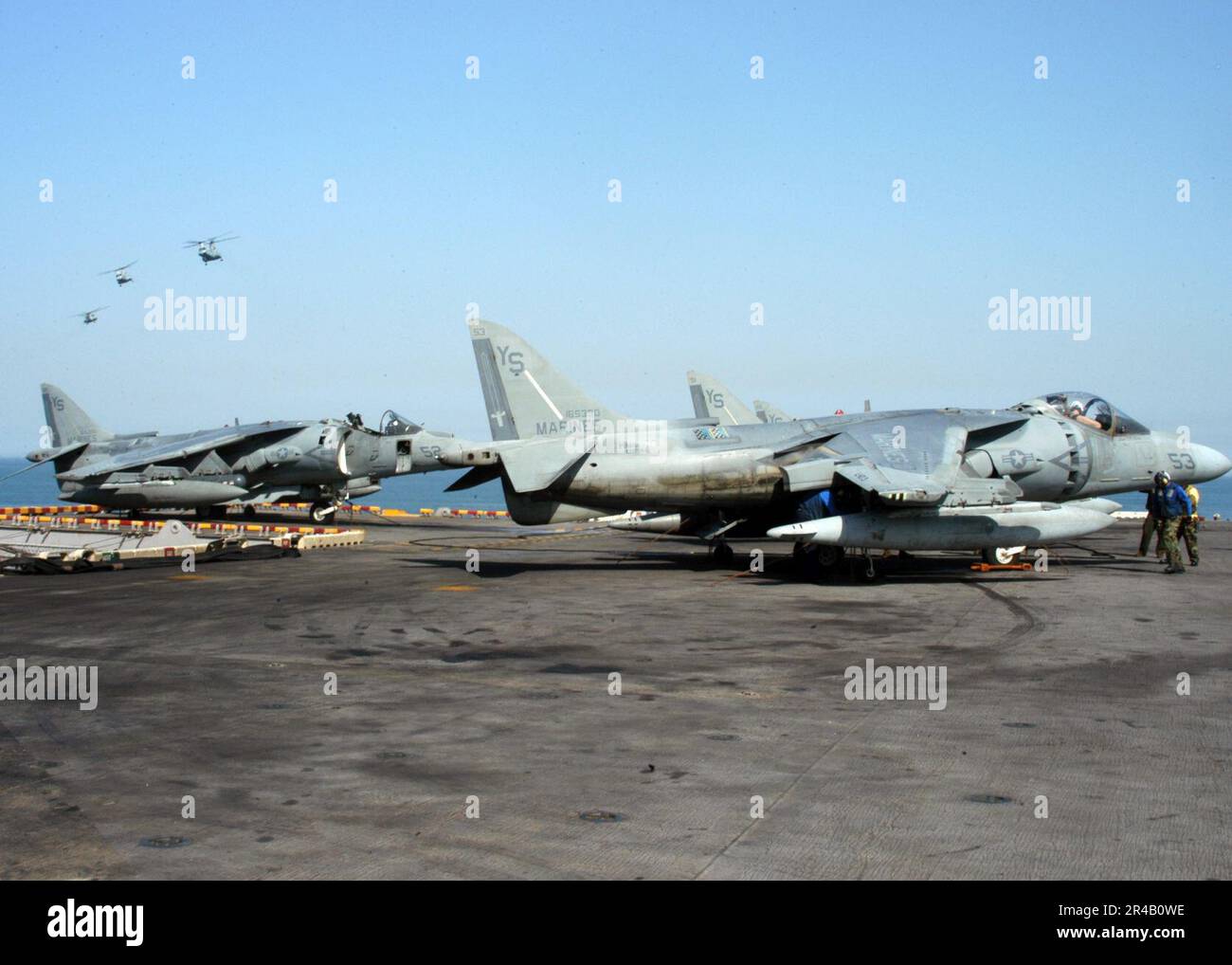 US Navy Flight deck personnel prepare for flight operation on the ...