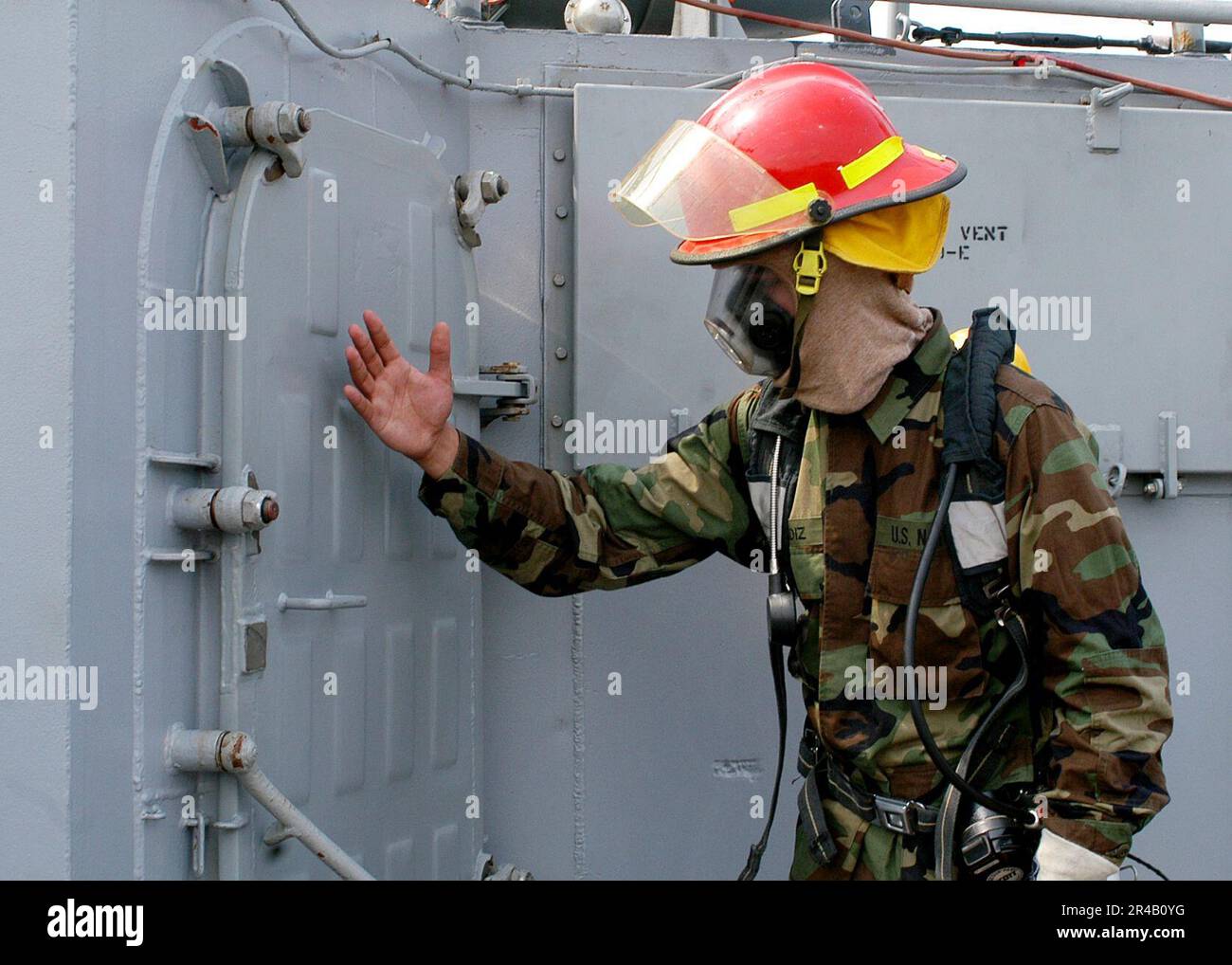US Navy Seaman assigned to Assault Craft Unit One (ACU-1), simulates ...