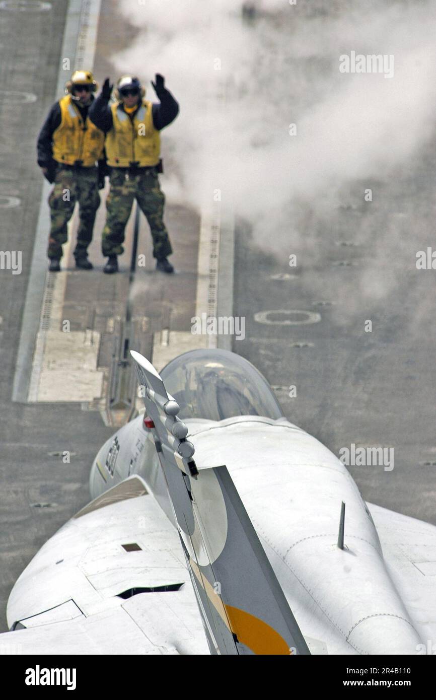 US Navy Aviation Boatswain's Mate Handlers direct an F-A-18C Hornet ...