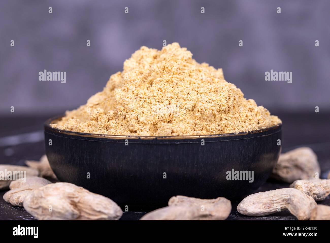 Ginger powder on dark background. Powdered dried ginger in bowl Stock ...