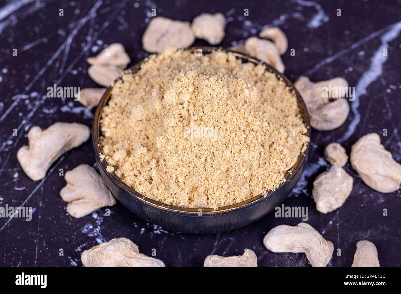 Ginger powder on dark background. Powdered dried ginger in bowl Stock ...