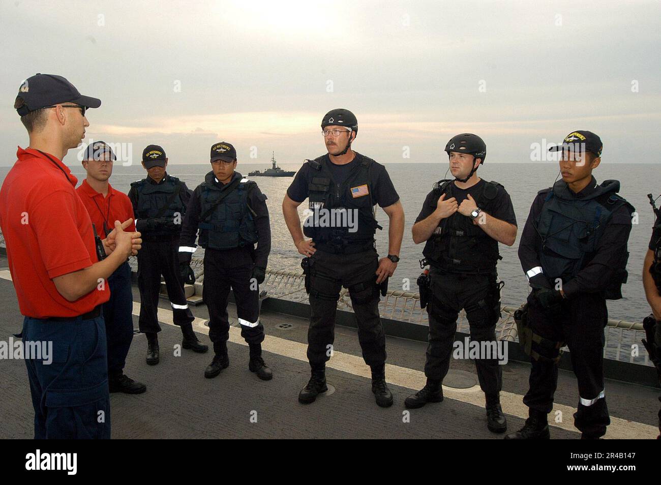 US Navy Members of the combined USS Rodney M. Davis (FFG 60) and RSS ...