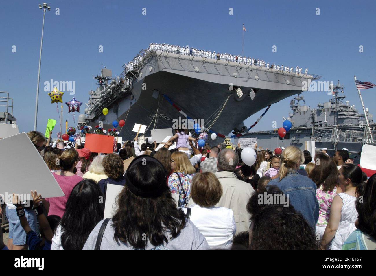 US Navy Families and friends wait patiently as the amphibious assault ...
