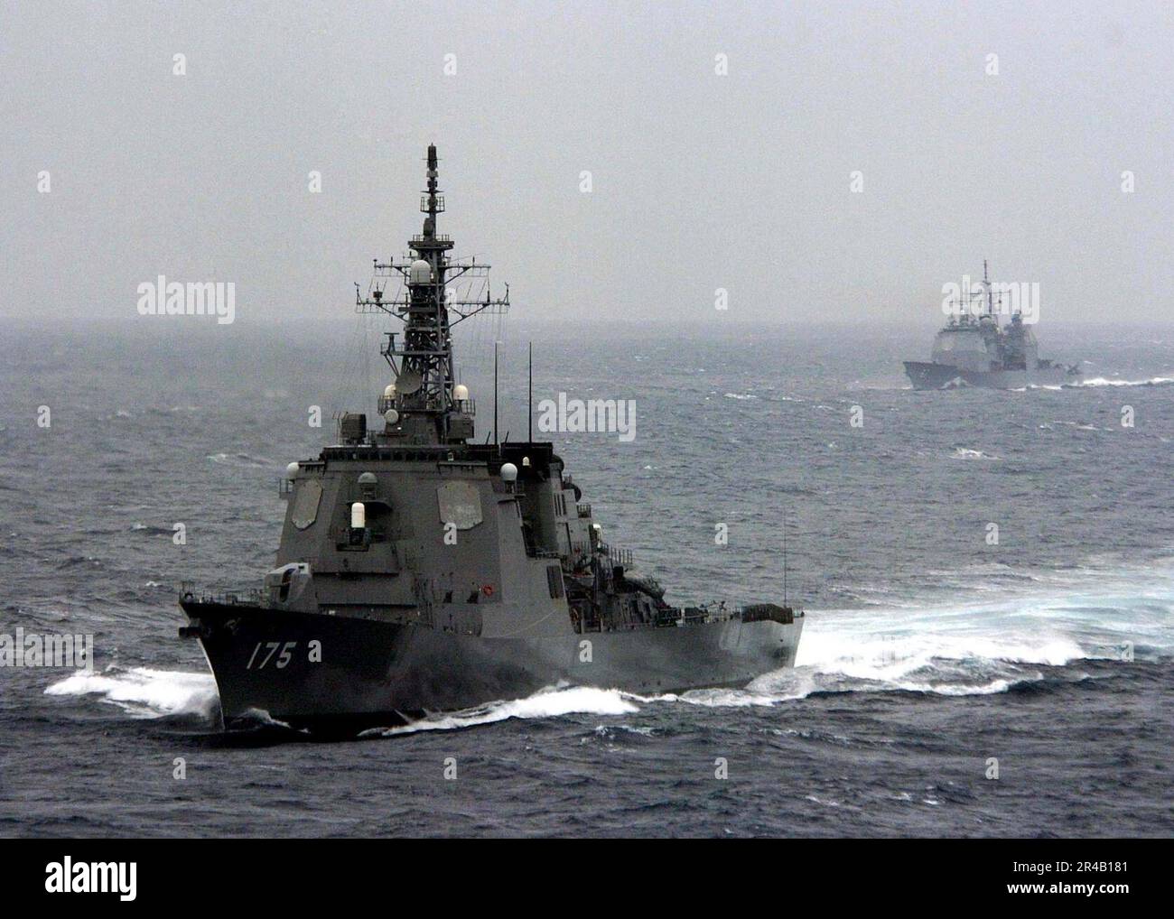 US Navy The Japanese Maritime Self Defense (JDS) ship JDS Myoko (DDG 175), foreground, sails in ...