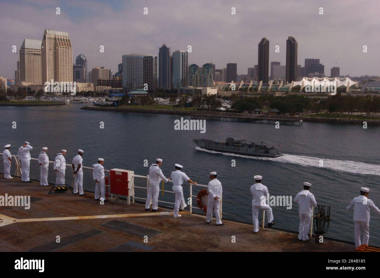 US Navy With the downtown area in the background, Sailors assigned to ...