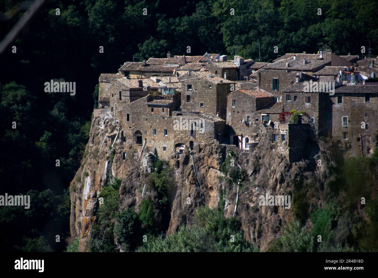 A stunning aerial view of an ancient city of Calcata on a rocky ...
