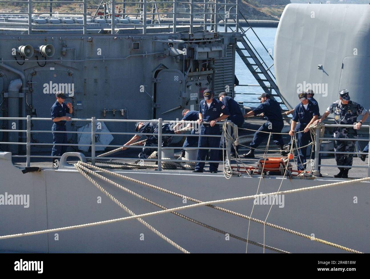 US Navy Crewmembers aboard the guided missile cruiser USS Philippine ...