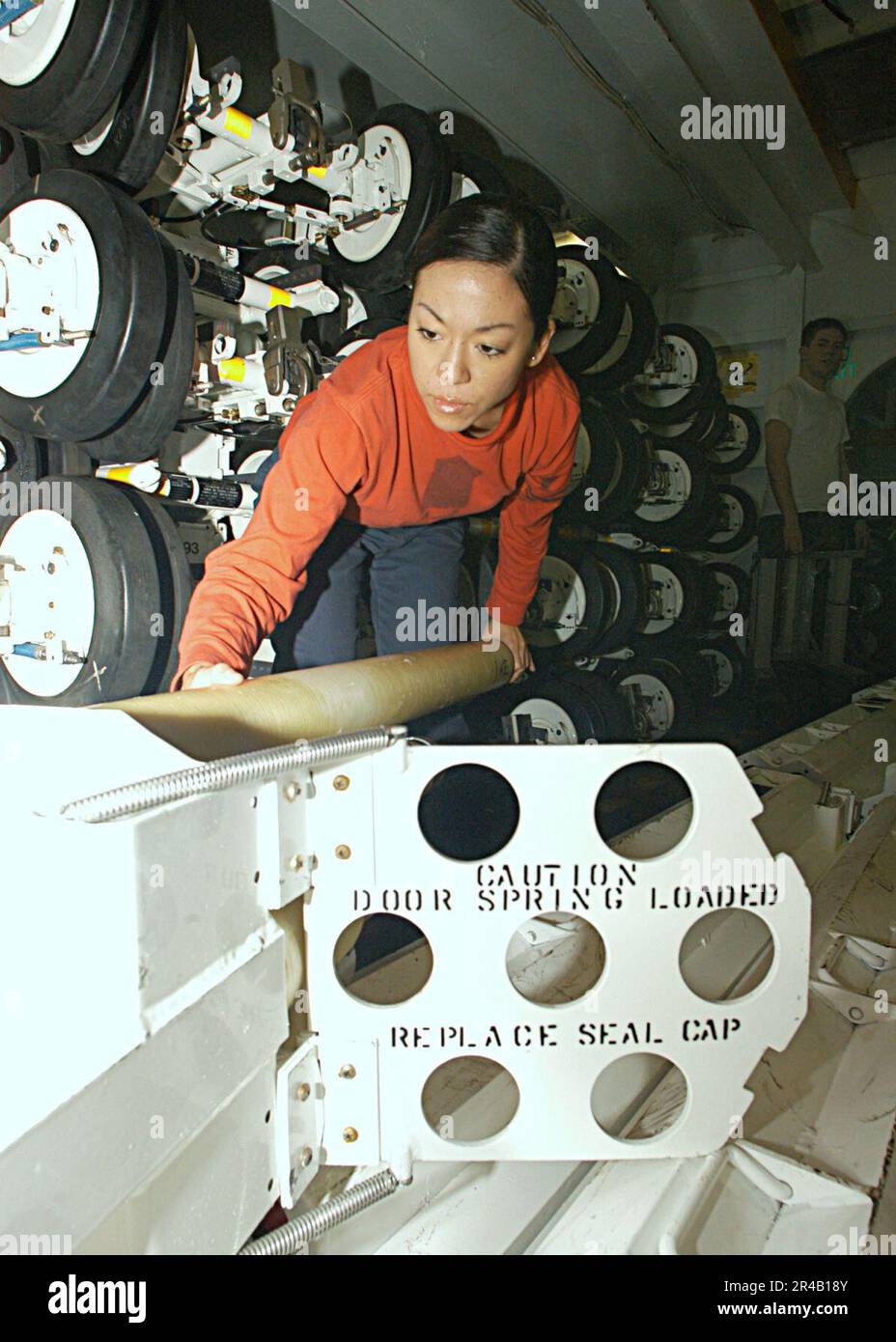 US Navy Aviation Ordnanceman 2nd Class removes LAU-7 nitrogen bottles ...