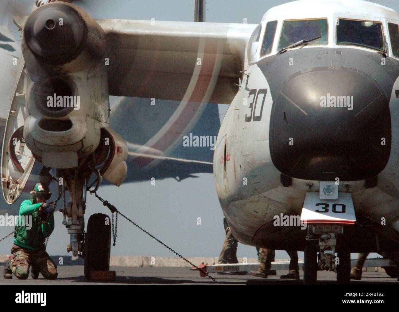 US Navy A Sailor assigned to Fleet Logistics Support Squadron Three ...
