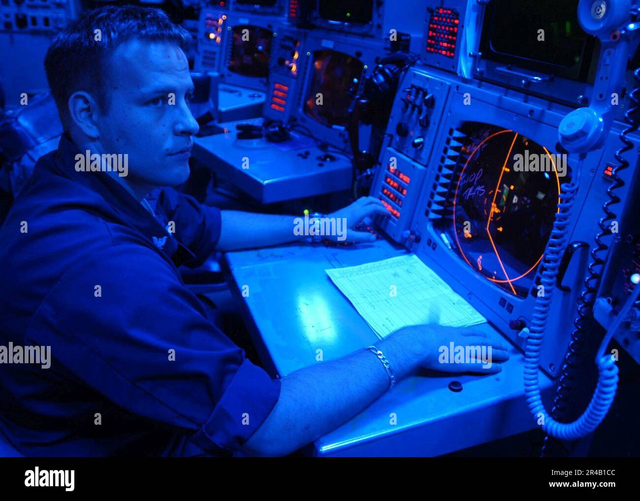 US Navy Operations Specialist 2nd Class mans the strike control console ...