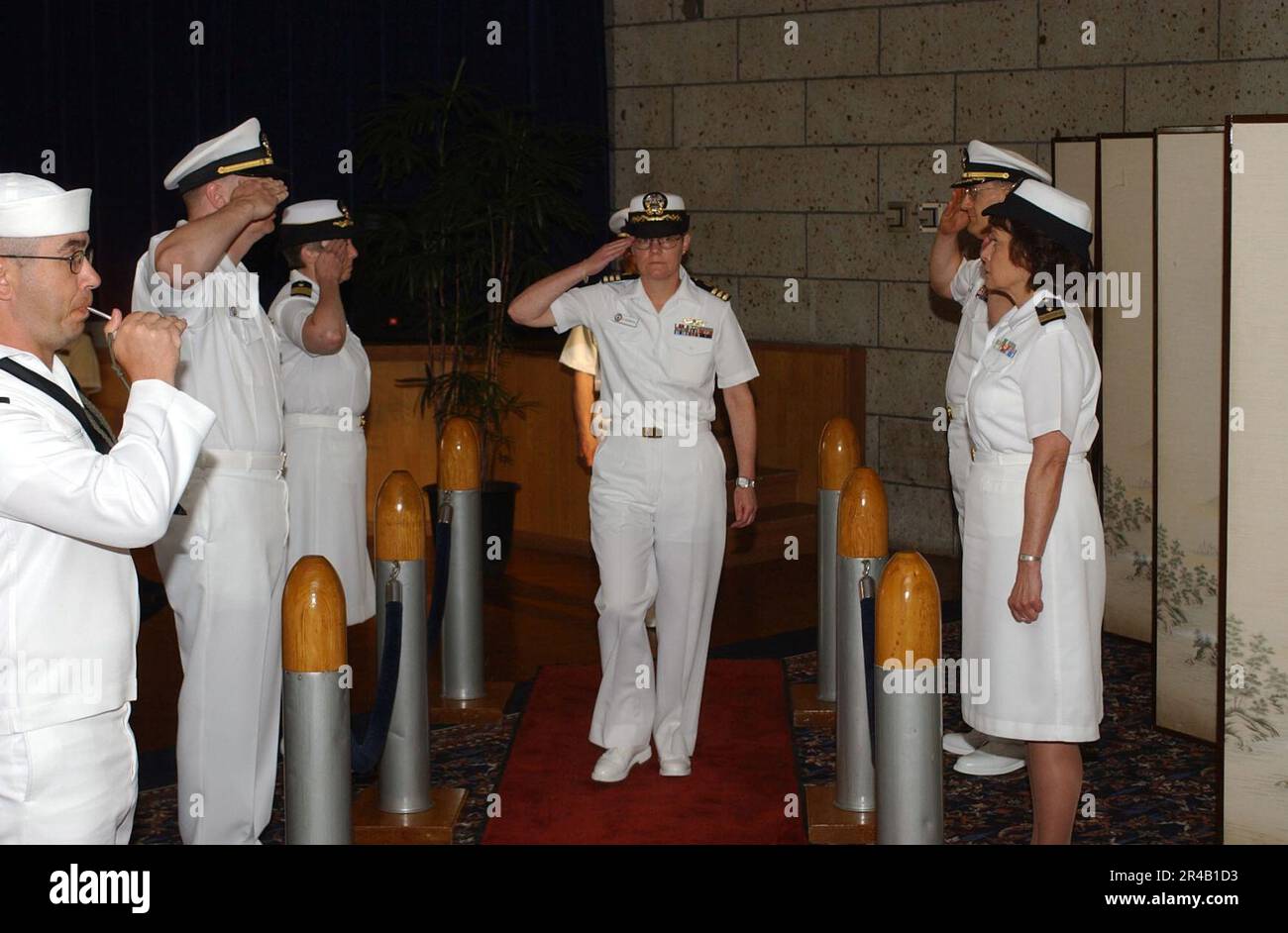US Navy Cmdr. salutes her staff one last time, after twenty-one years ...