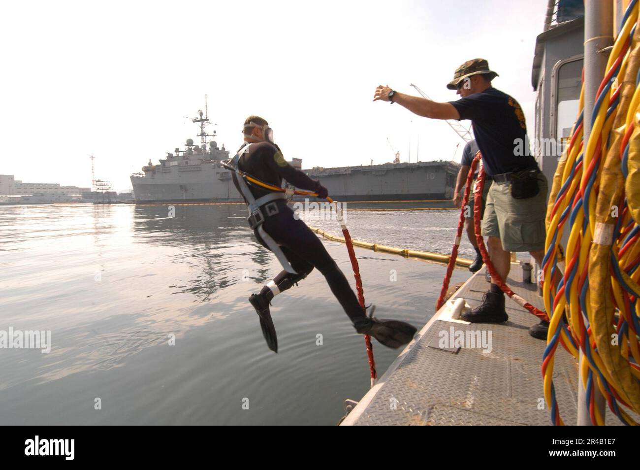 US Navy Aviation Boatswain's Mate 3rd Class assists Operations ...