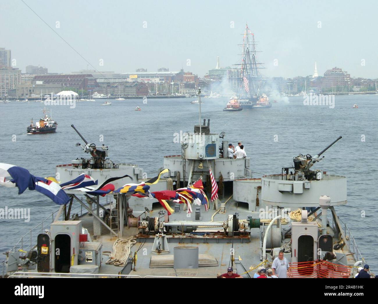 US Navy LST 325, a vintage World War II tank landing ship, follows USS ...
