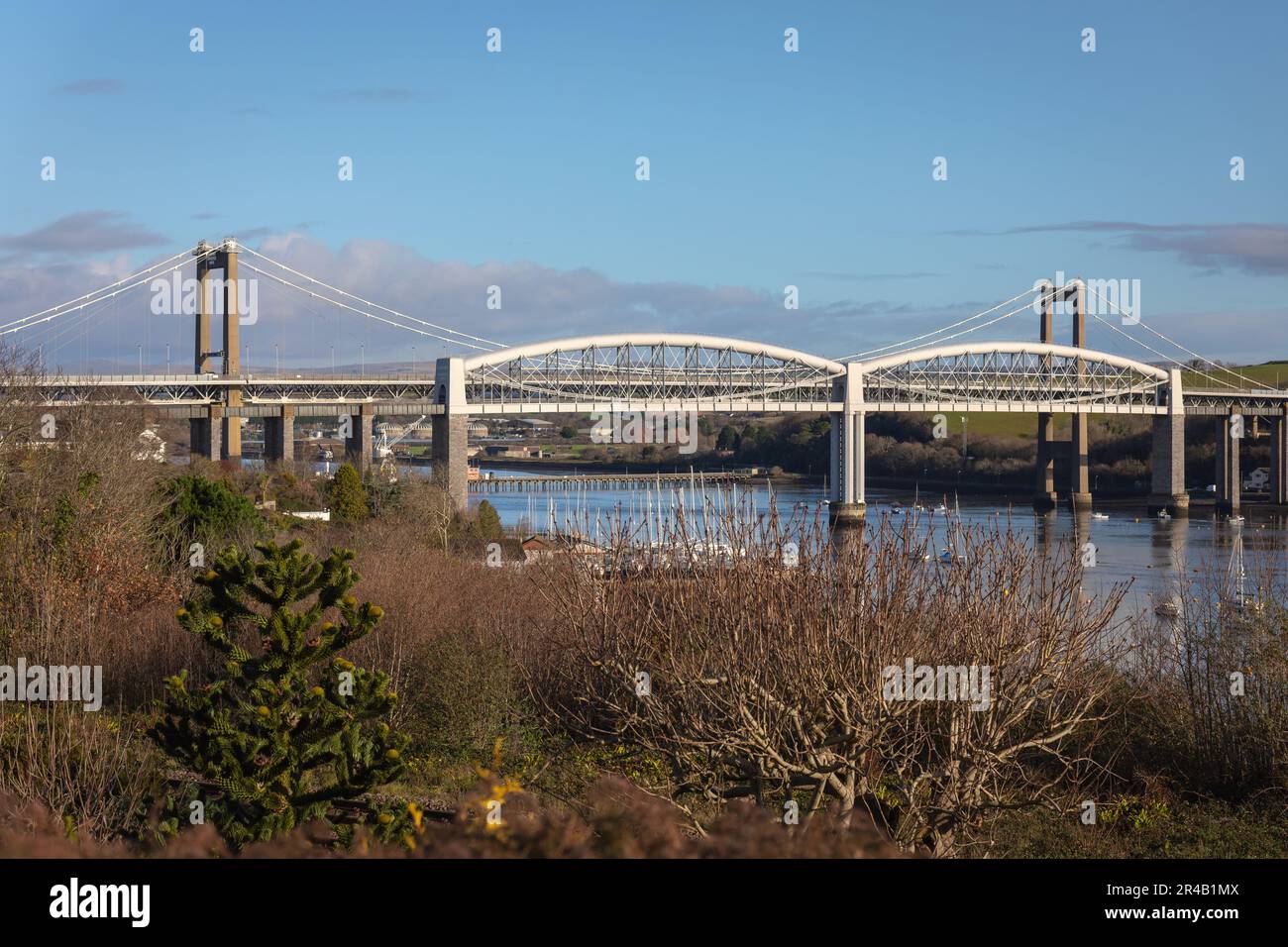 A picturesque scene of a bridge spanning across a body of water as two ...