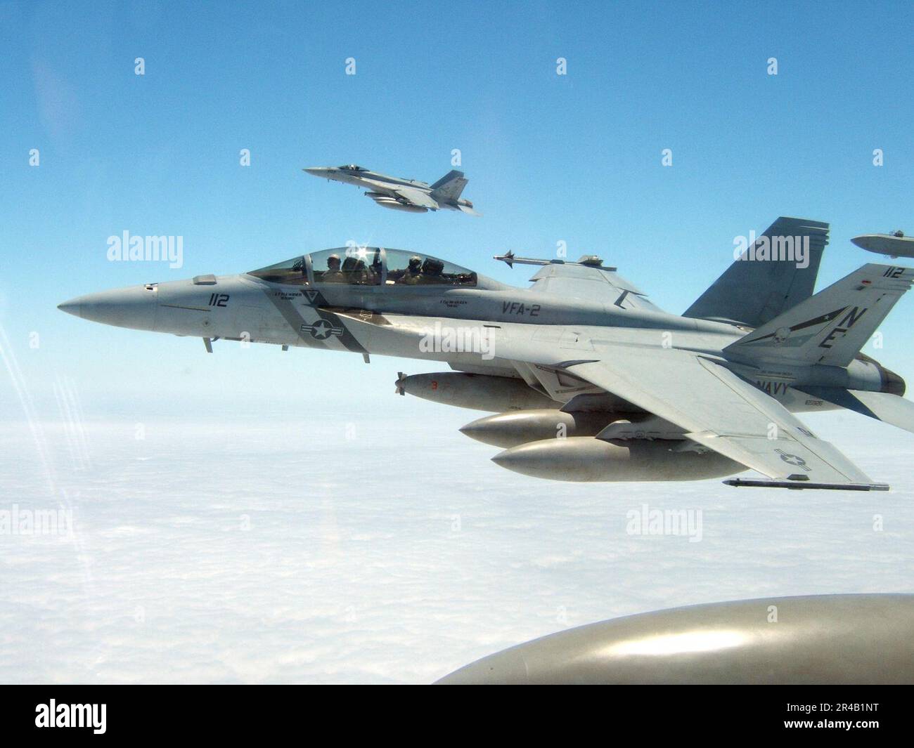 US Navy An F-A-18F Super Hornet flies in a loose formation with an F-A ...