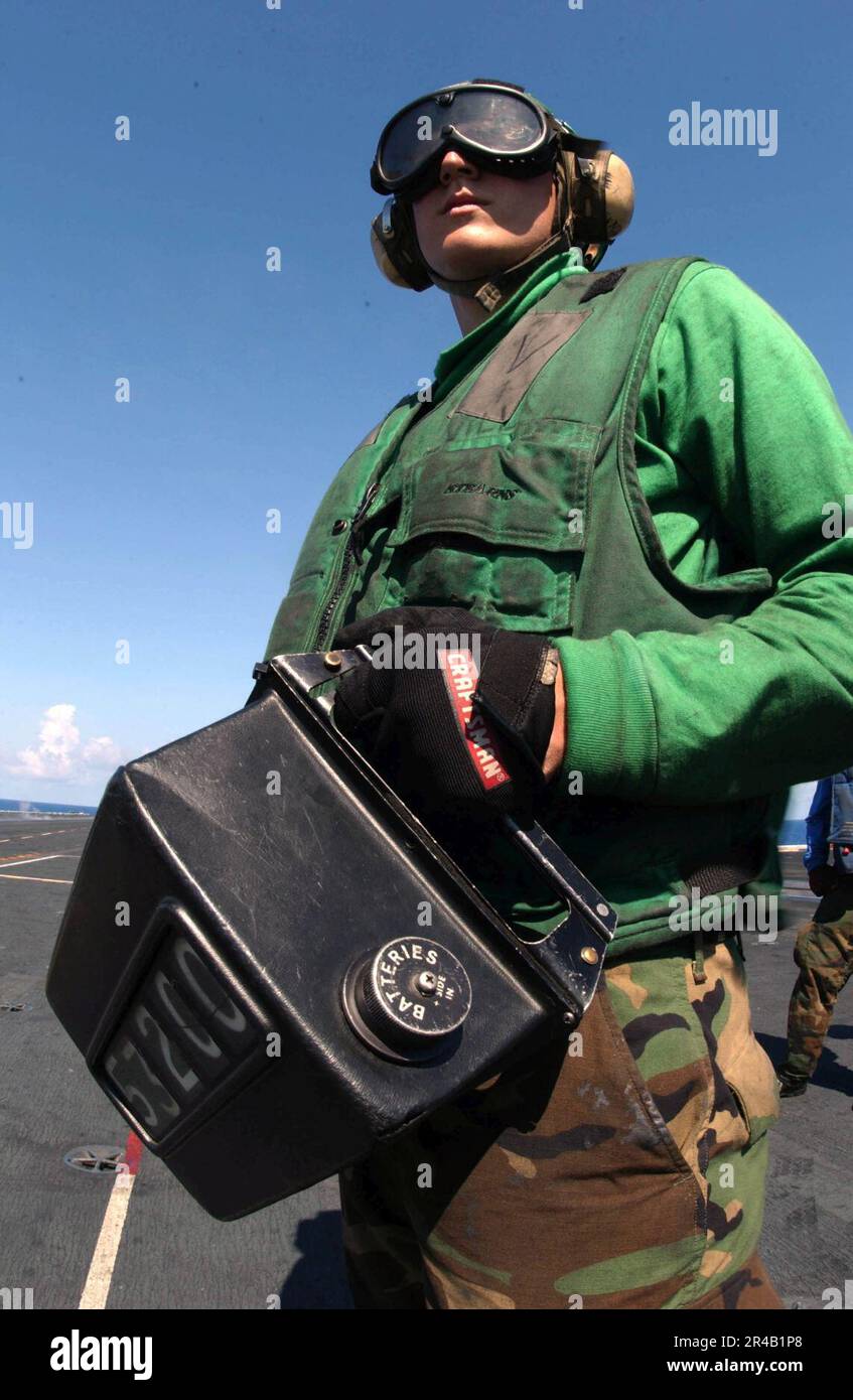 US Navy Airman stands by after verifying the aircraft weight ...
