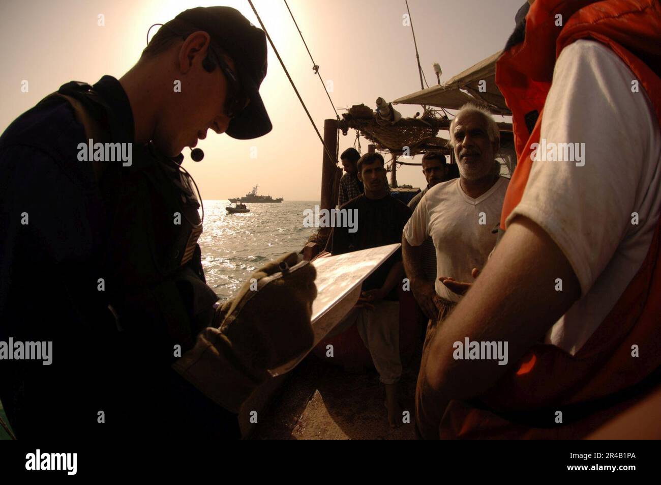 US Navy Sailors assigned to the coastal patrol boat USS Chinook (PC 9 ...