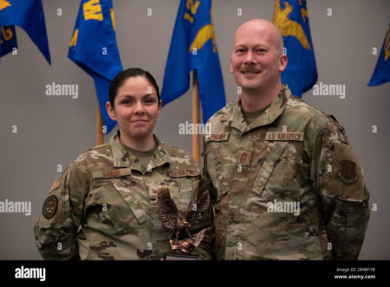 U.S. Air Force Chief Master Sgt. Kyle Hoopingarner, left, command chief ...