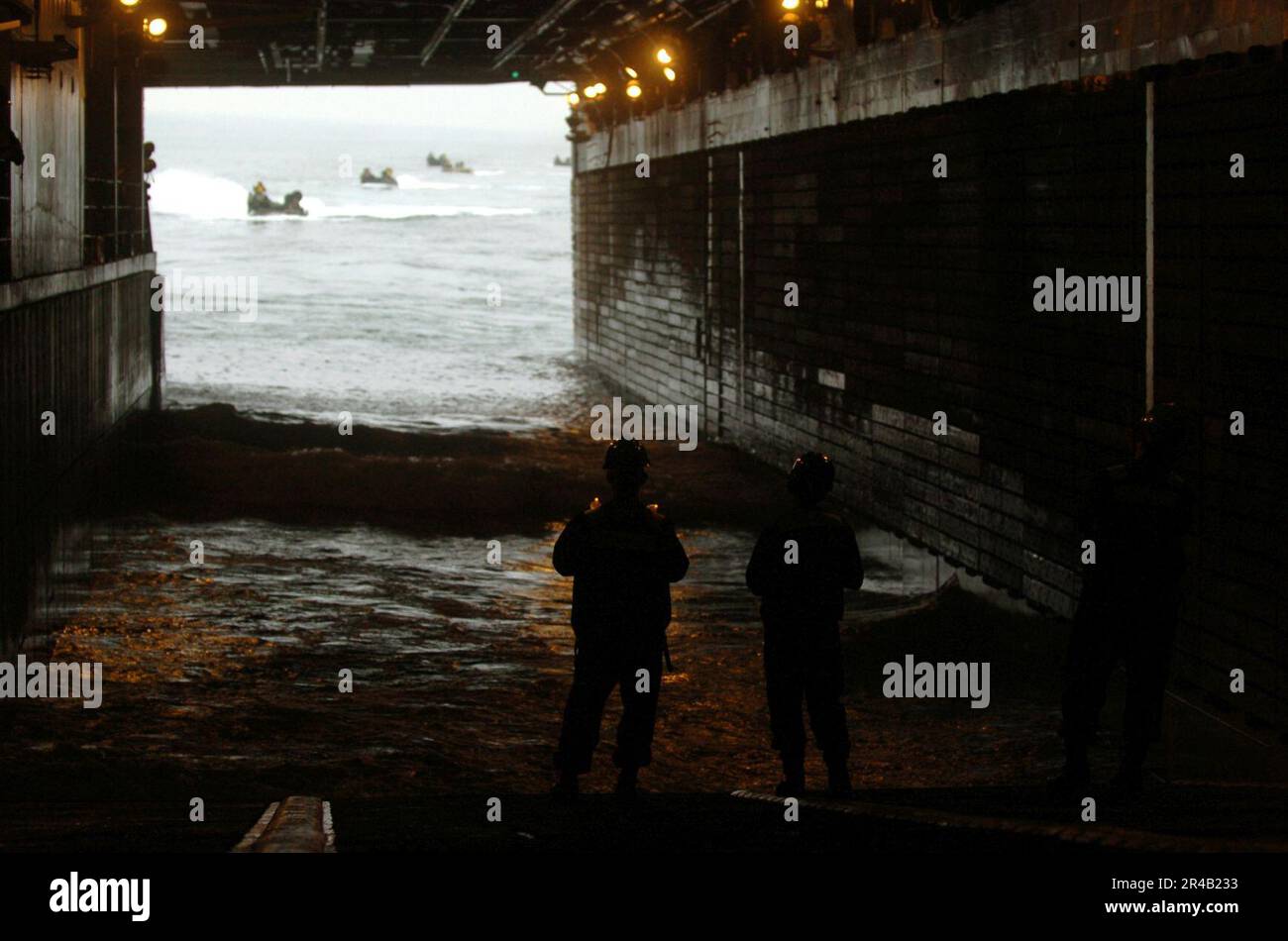 US Navy Deck Department Sailors direct amphibious assault vehicles ...