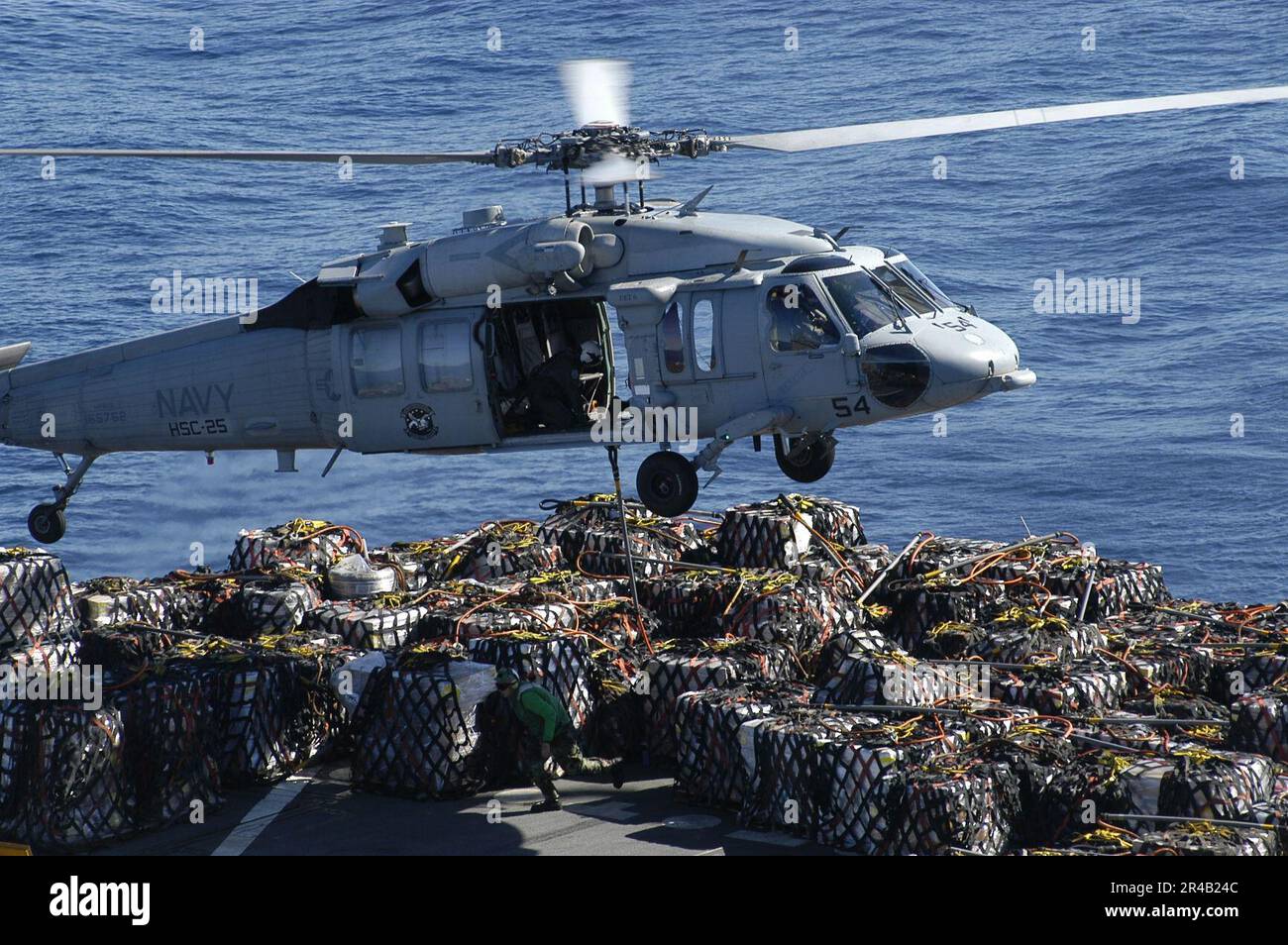 US Navy A Sailor assigned to the Military Sealift Command (MSC) combat ...