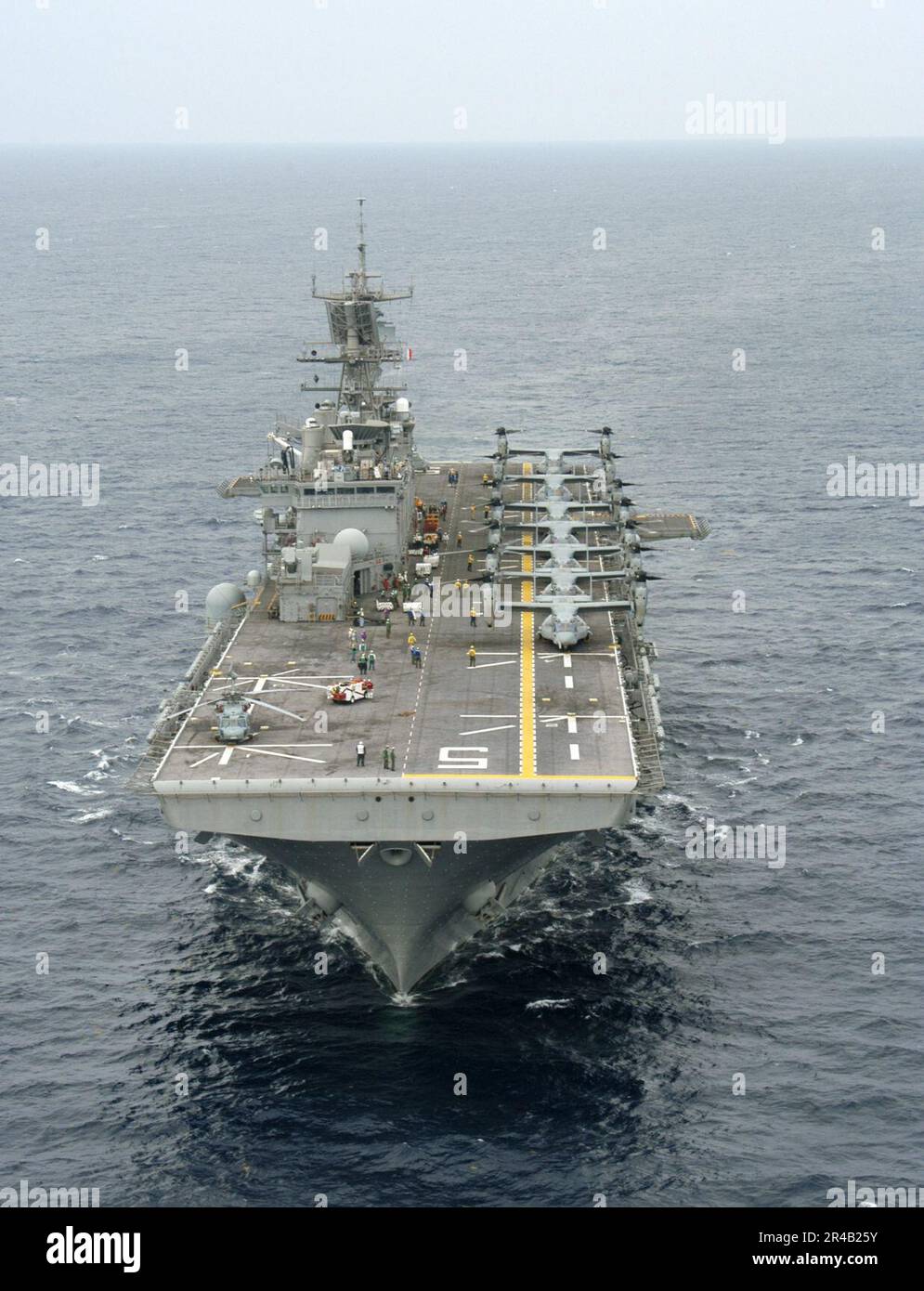 US Navy The amphibious assault ship USS Bataan (LHD 5) shown underway with all eight MV-22 ...