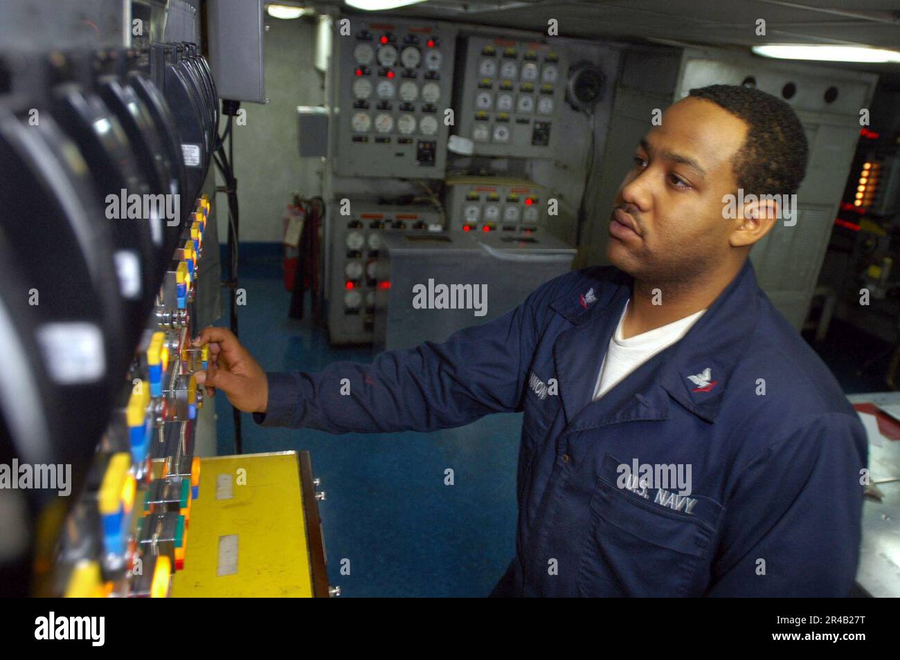 US Navy Damage Controlman 3rd Class mans the list control watch from ...