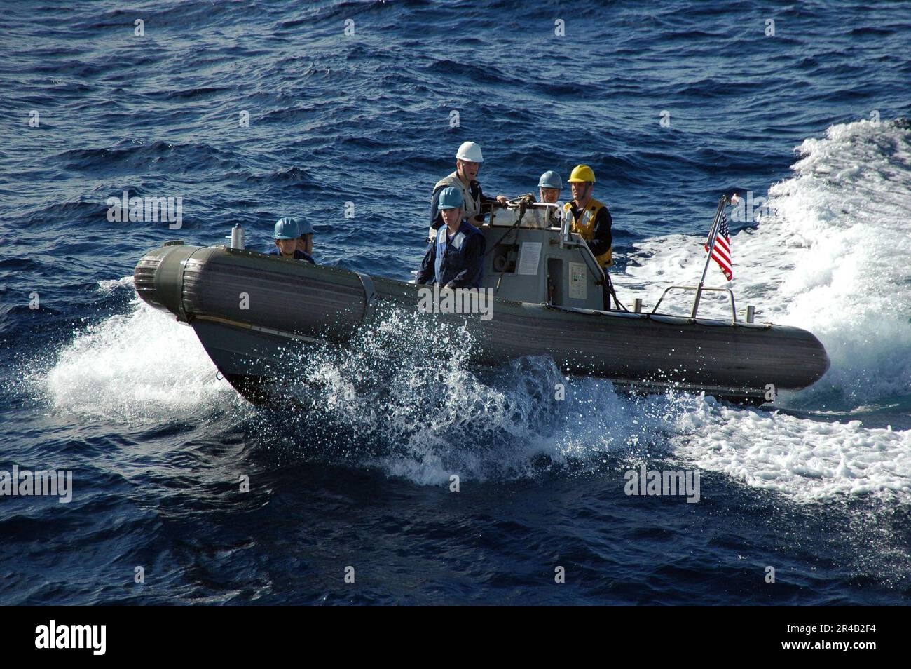 US Navy A Rigid Hull Inflatable Boat (RHIB) returns to the guided ...