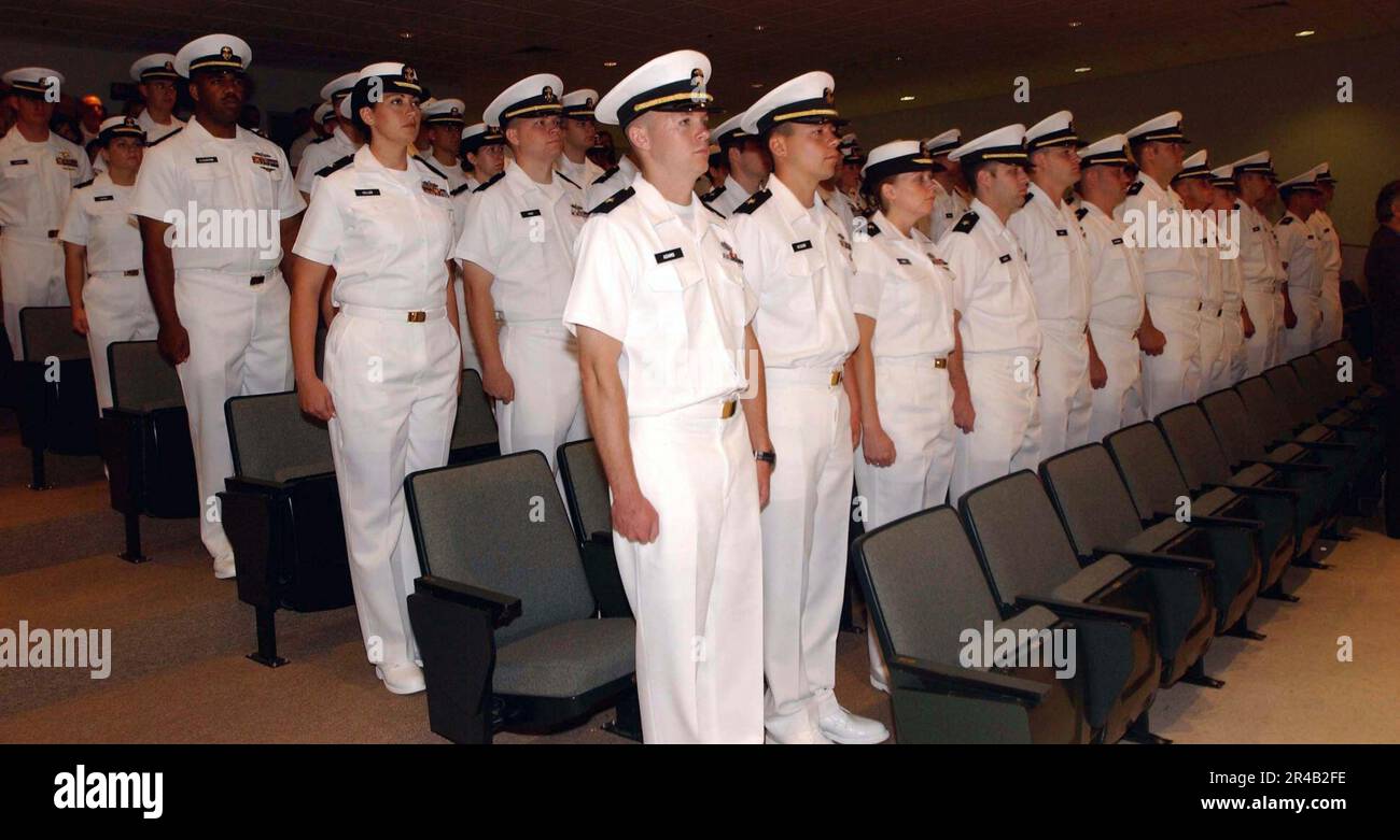 US Navy Fifty-nine officer candidates stand at attention during the ...