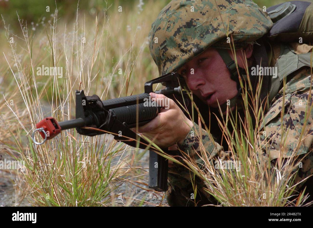 US Navy A U.S. Marine aims his M-16 rifle, armed with blanks, during ...