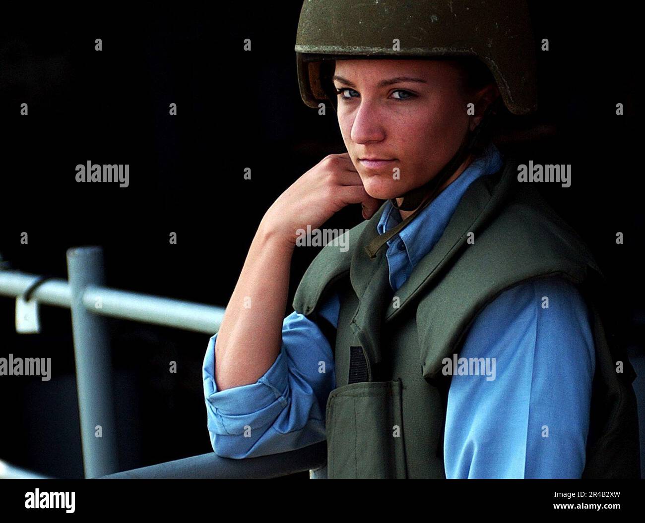 US Navy Torpedoman's Mate Seaman Recruit stands an armed watch at a .50 ...