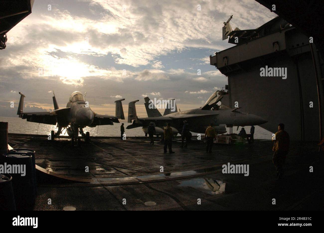 US Navy Aircraft elevator one prepares to transport aircraft to the ...