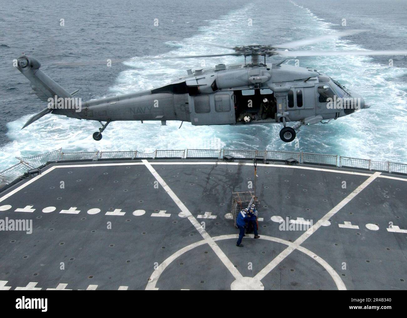 US Navy Crewmen assigned to the Military Sealift Command (MSC) fast ...