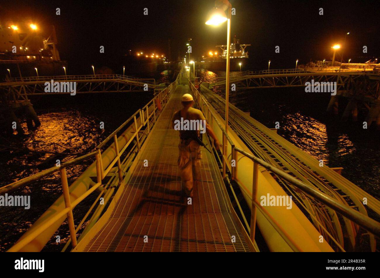 US Navy Master-at-arms 1st Class rushes to a security post after ...