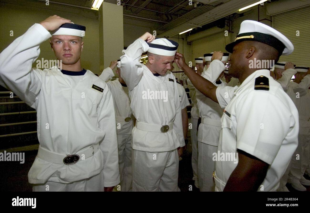 US Navy Midshipman 1st Class right, instructs a Midshipman candidate on ...