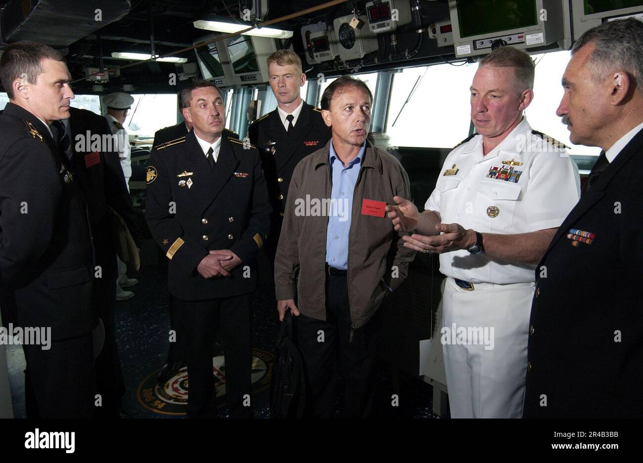 US Navy Commanding Officer, USS Curtis Wilber (DDG 54), Cmdr. speaks to ...