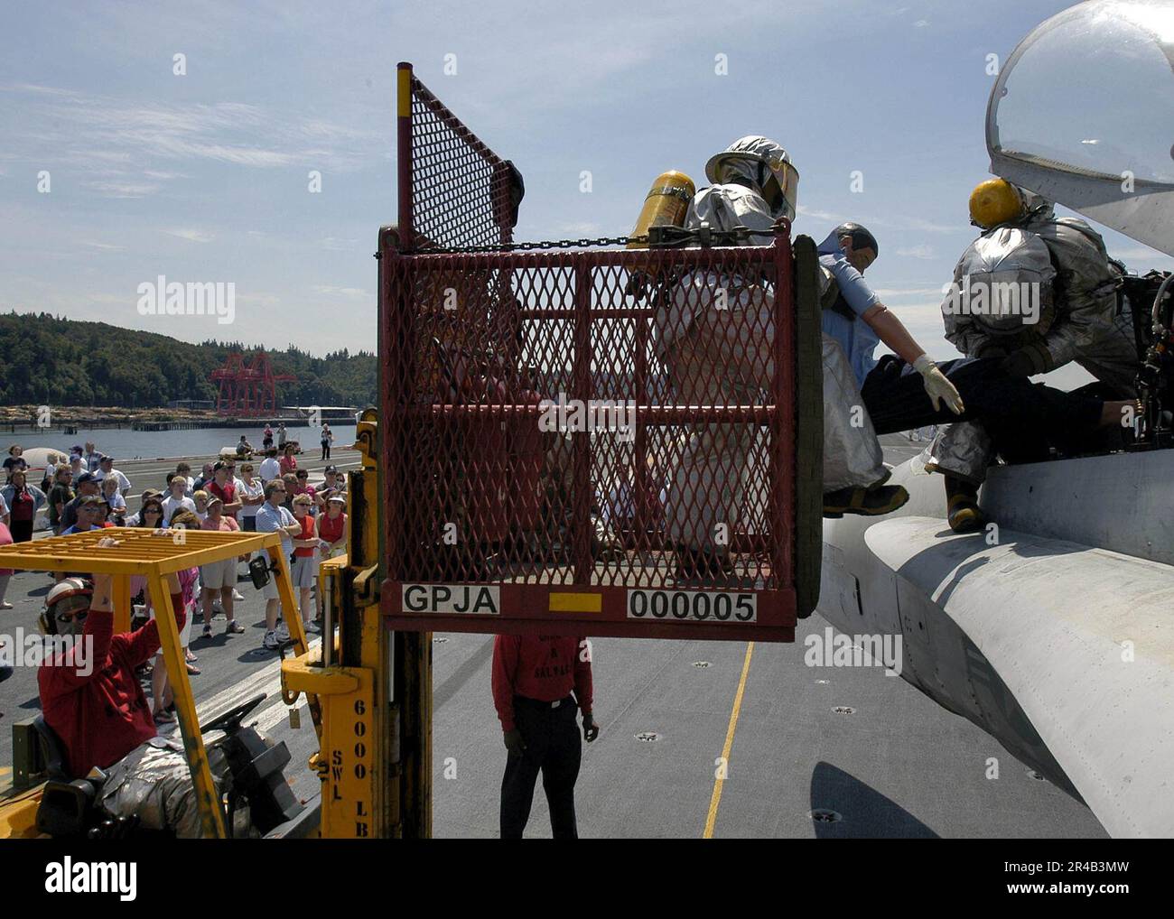 US Navy Members of Crash and Salvage demonstrate a rescue exercise on ...