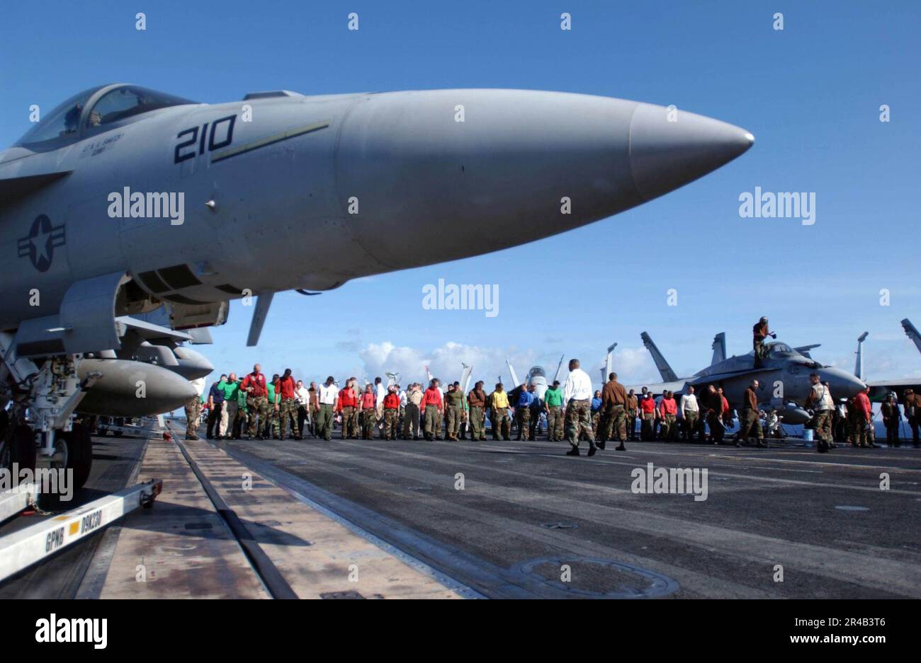 US Navy Crew members participate in a Foreign Object Damage (FOD) walk ...