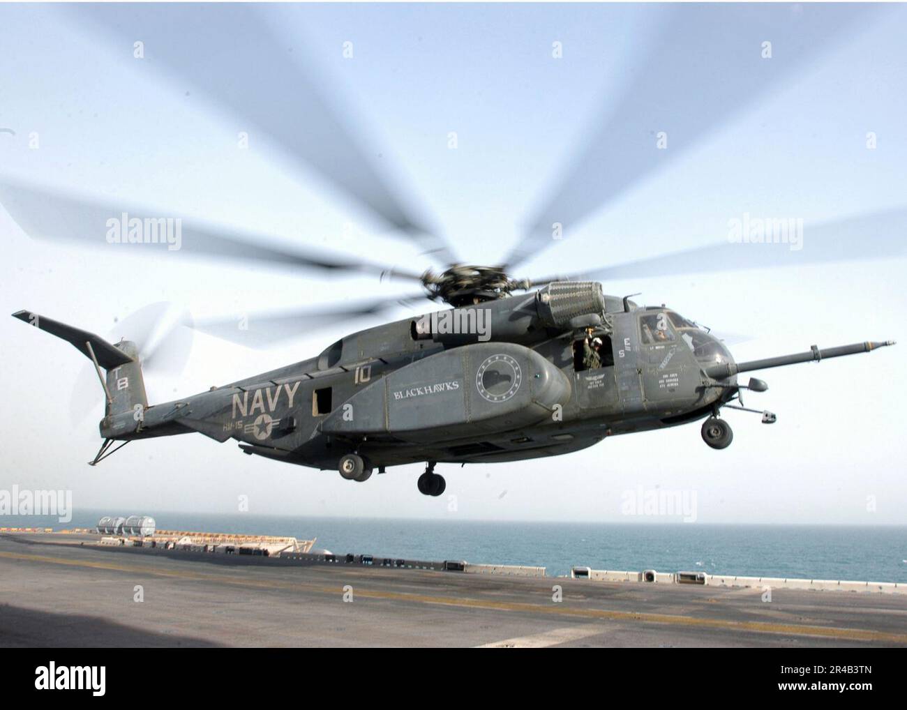 US Navy A CH-53 Sea Stallion helicopter departs the flight deck aboard ...