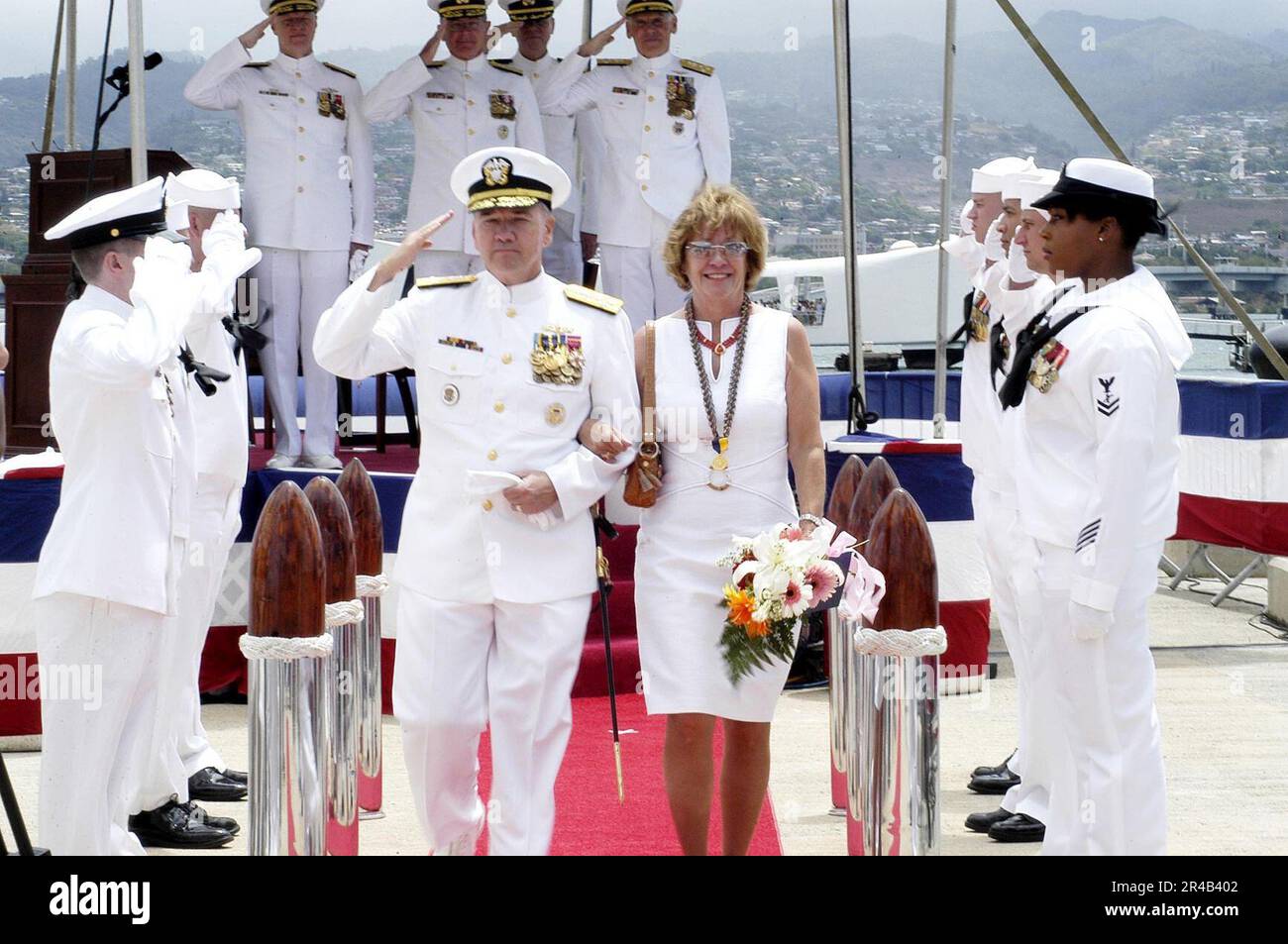 US Navy Adm. Walter F. Doran and his spouse, pass through the honor ...
