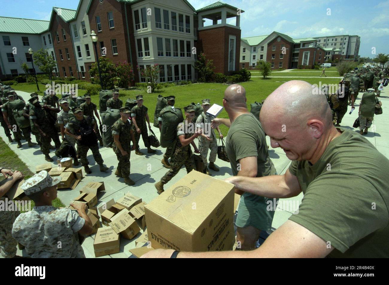 US Navy U.S. Marine Corps Staff Sgt. foreground, and Gunnery Sgt. give ...