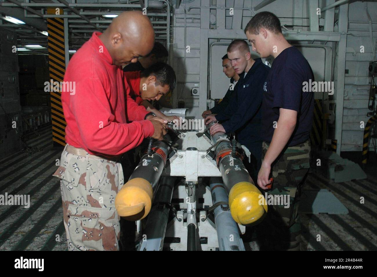 US Navy Aviation Ordnancemen inspect AIM-9 Sidewinder air-to-air ...
