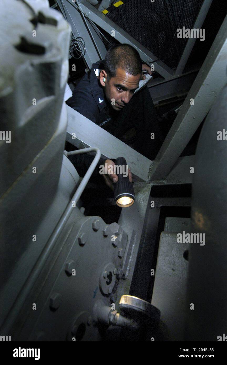 US Navy Machinist Mate 3rd Class checks a temperature gauge Stock Photo ...
